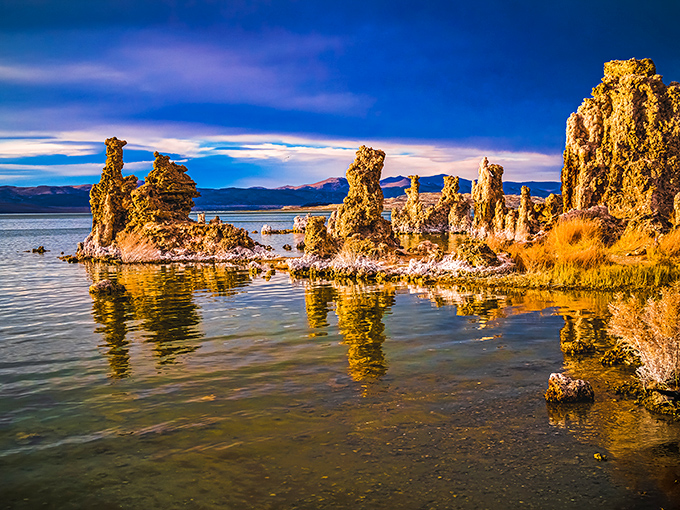 Nature's own sculpture garden rises from Mono Lake's glassy surface, creating a landscape that belongs in a sci-fi movie's establishing shot.