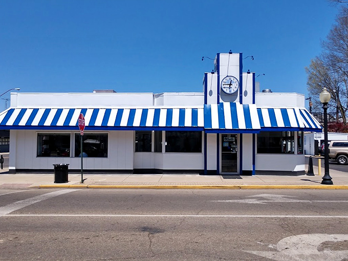 That iconic blue and white awning isn't just eye-catching&mdash;it's a time machine disguised as a diner, beckoning hungry travelers with promises of comfort food perfection.