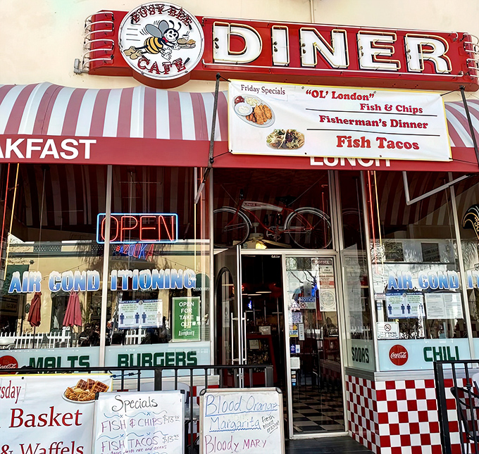 The classic red and white checkered facade of Busy Bee Cafe beckons like a time portal to simpler days when diners ruled American roadways.