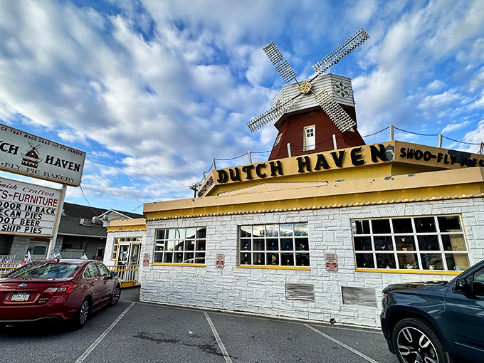 The iconic windmill atop Dutch Haven stands like a sugary lighthouse, beckoning hungry travelers on Route 30 with promises of Pennsylvania Dutch delights.