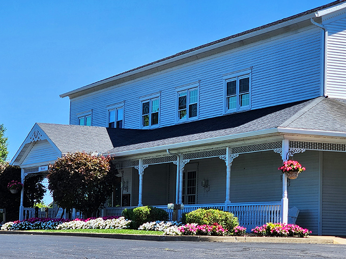 The welcoming white exterior of Amish Door Restaurant stands like a beacon of comfort food against Ohio's rolling countryside, promising delicious memories before you even step inside.