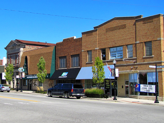 Downtown Nappanee's historic brick facades stand as living witnesses to a century of small-town American life, their warm tones glowing in the Indiana sunshine.