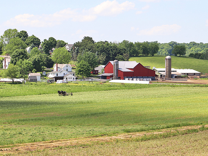 Classic Americana unfolds before your eyes &ndash; horse-drawn plows still working fertile fields while that iconic red barn stands sentinel over generations of tradition.