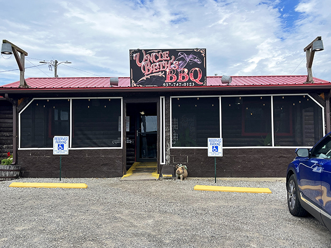 The unassuming exterior of Uncle Beth's BBQ hides a smoky paradise within. That little bulldog seems to know what treasures await inside.