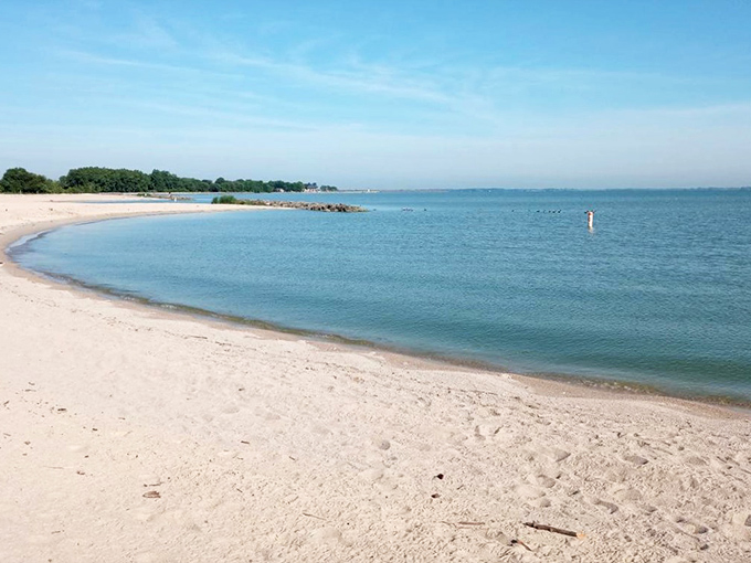 The gentle curve of Erie Beach's shoreline embraces Lake Erie's crystal waters like nature's perfect smile, inviting visitors to leave footprints and take memories.