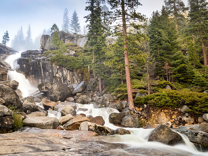 Nature's masterpiece in full force! Bassi Falls thunders down granite steps, creating a symphony of sound and spray that makes smartphones suddenly seem very unimportant.
