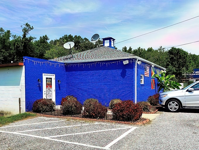 The little blue building that could! Ray's vibrant exterior stands out like a Caribbean jewel in Aberdeen's landscape, promising tropical flavors inside.