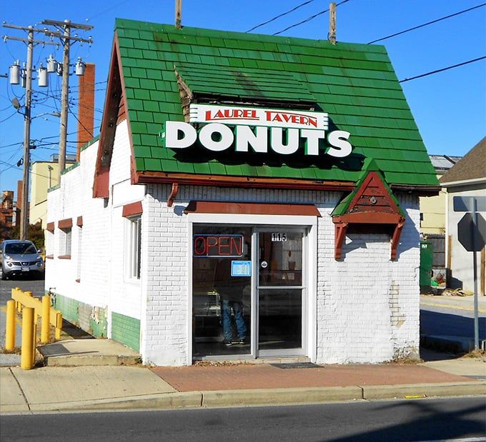 The little donut shop with the big green roof stands like a beacon of sweetness on Washington Boulevard, promising morning salvation one glazed ring at a time.