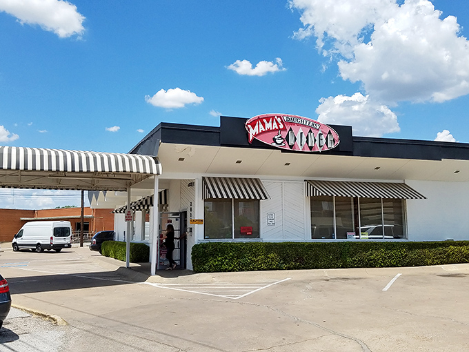 The iconic white building with its distinctive red signage stands like a beacon of breakfast hope against the Texas sky.