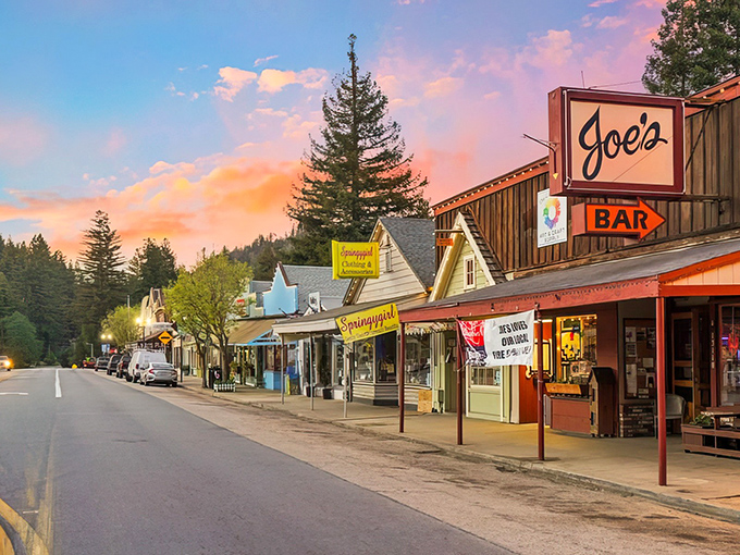Main Street magic at sunset &ndash; Joe's Bar beckons with its vintage sign while Scarborough Faire adds a splash of yellow to this redwood-framed slice of Americana.