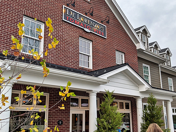As twilight falls, DeLorenzo's brick facade glows like a beacon for hungry travelers. This isn't just dinner&mdash;it's a pilgrimage to pizza paradise.