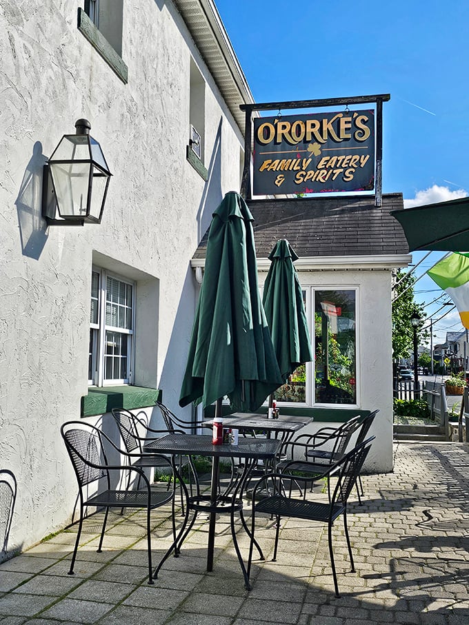 The welcoming white exterior of O'Rorke's, where outdoor tables await under folded umbrellas&mdash;a perfect spot for people-watching while savoring Gettysburg's flavors.