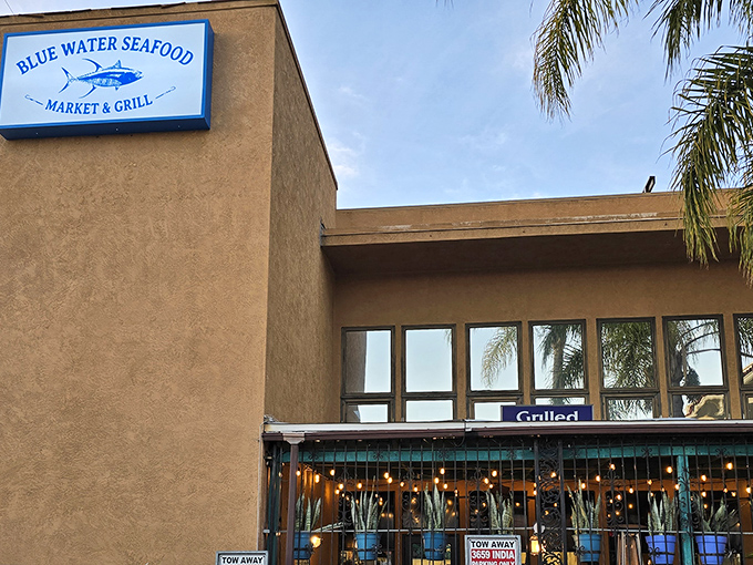 The unassuming exterior of Blue Water Seafood hides culinary treasures within. Like finding a pearl in an oyster, this modest storefront delivers oceanic delights beyond its simple fa&ccedil;ade.
