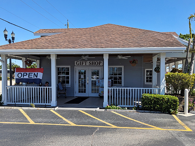 The welcoming front porch of Yoder's Restaurant beckons with rocking chairs and simple charm, proving paradise sometimes comes with an "OPEN" sign and zero pretension.