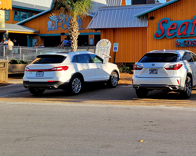 The iconic wooden exterior of The Back Porch, with its distinctive blue signage, promises seafood treasures within. Florida coastal dining at its unpretentious best.