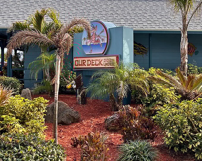 The tropical welcome mat! Our Deck Down Under's vibrant exterior promises Florida charm with its swaying palms and dancing lobster mascot.