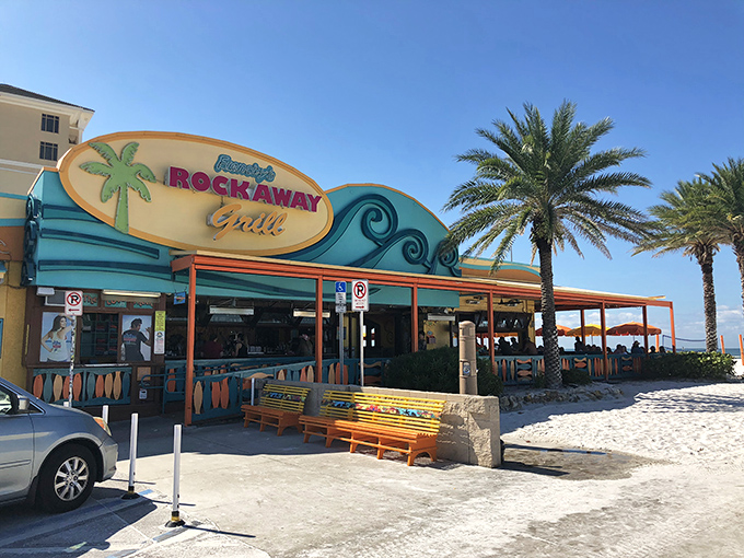 The turquoise and coral exterior of Frenchy's Rockaway Grill stands like a tropical mirage against Clearwater's pristine white sand beach.
