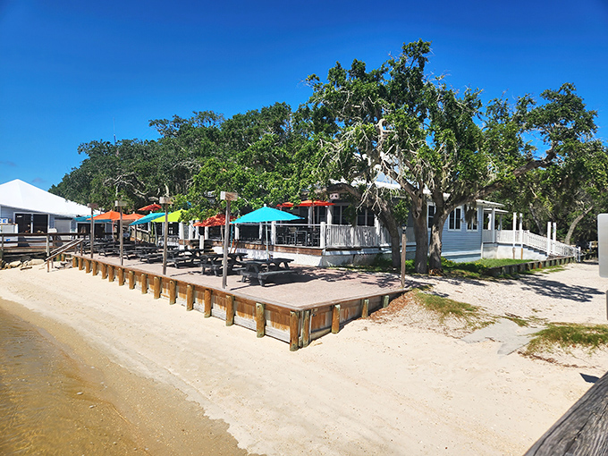 Paradise found: Aunt Kate's waterfront deck invites you to kick back under colorful umbrellas while the Tolomato River whispers sweet nothings to your appetite.