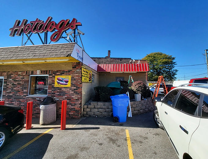 The bright yellow sign beckons like a lighthouse for the hungry&mdash;where being "in the dog house" is actually the goal, not the punishment.