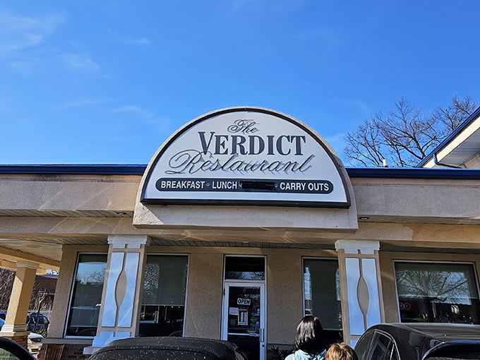 The distinctive blue roof of Verdict Restaurant stands out like a beacon for breakfast lovers in Wheaton's strip mall landscape.