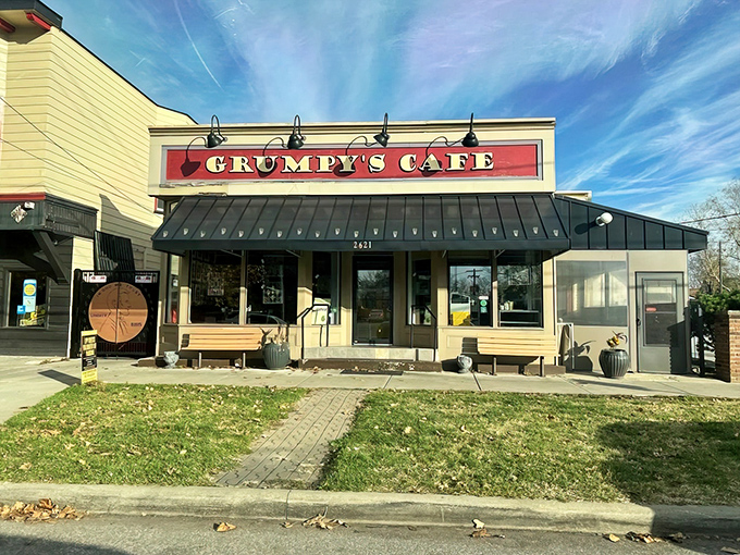 Sunshine meets comfort food at Grumpy's Cafe, where the cheerful yellow exterior and bold red sign promise a breakfast experience worth getting out of bed for.
