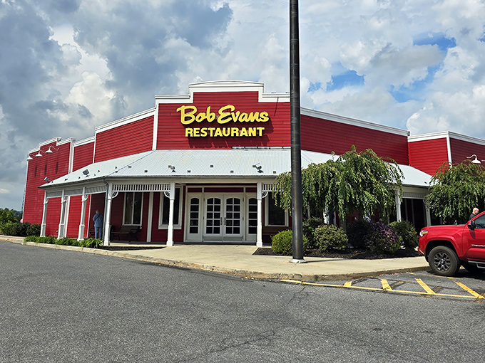The iconic red barn exterior of Bob Evans in Breezewood stands like a beacon of breakfast hope for hungry travelers crossing Pennsylvania's highways.