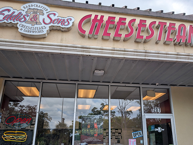 The storefront beckons like a lighthouse for hungry souls, with that bold red "CHEESESTEAKS" sign promising delicious salvation in Jacksonville's Southpoint Plaza.