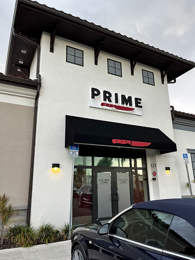 The striking white exterior with its bold red knife logo promises serious business when it comes to steak. This isn't a place that minces words&mdash;or meat.