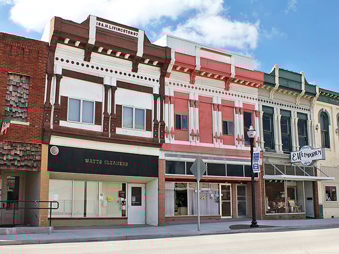 Rock Port's historic Main Street showcases classic Americana with its colorful facades and vintage storefronts. Watts Cleaners stands as a testament to businesses that have served generations.