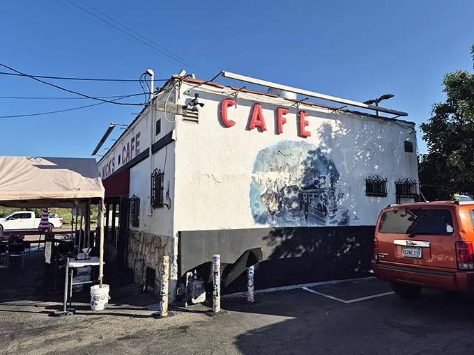 The unassuming white stucco building with bold red "CAFE" lettering stands like a time capsule amid industrial Los Angeles. No fancy facade needed when the food speaks volumes.