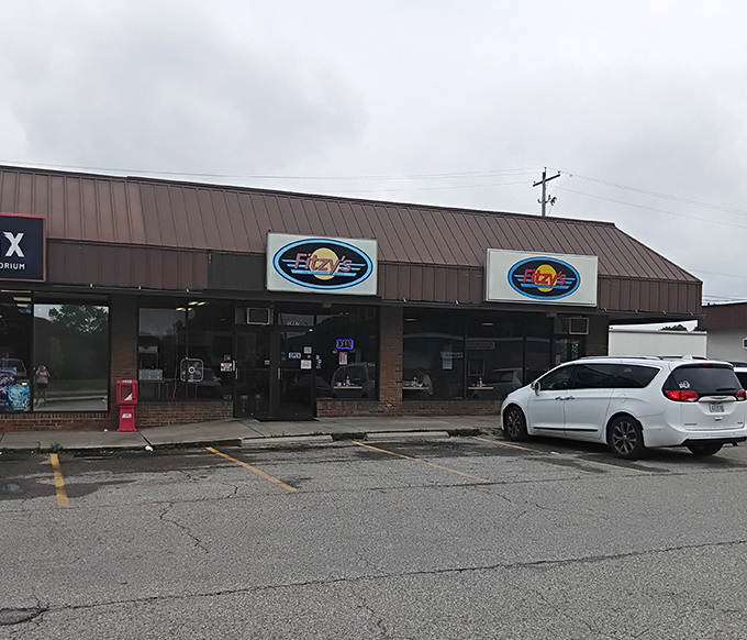 Fitzy's unassuming strip mall exterior is like that friend who doesn't brag but always delivers. Classic diner signage promises comfort food treasures waiting inside.