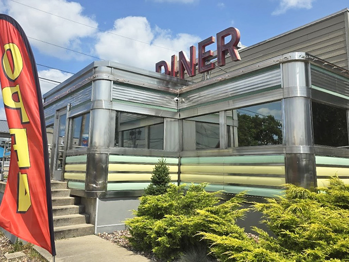 The gleaming stainless steel exterior of Broadway Diner stands like a time capsule in Baraboo, beckoning hungry travelers with its classic Americana charm.