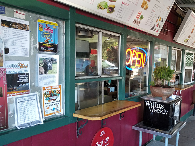 The classic red and white exterior beckons like a beacon of burger bliss along Highway 101.
