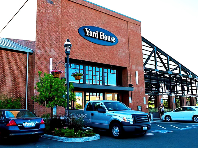 The sleek, modern exterior of Yard House stands like a culinary lighthouse in Fresno, beckoning hungry travelers with promises of craft beer and elevated comfort food.