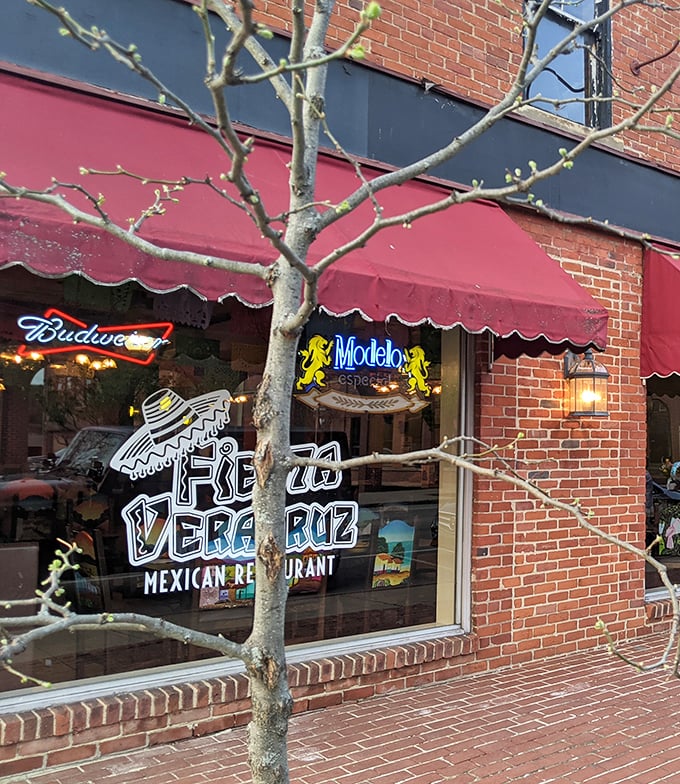 The iconic red awning and playful sombrero logo of Fiesta Veracruz beckon like an old friend saying, "Trust me, the tacos are worth it."