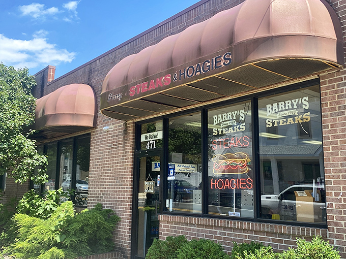 The unassuming brick storefront with burgundy awnings might not scream "food paradise," but locals know this is where cheesesteak dreams come true.