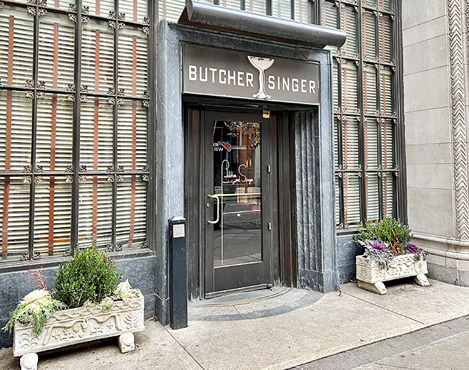 The unassuming entrance to Butcher and Singer belies the culinary magic within. Like finding a secret passage to carnivore heaven on Walnut Street.