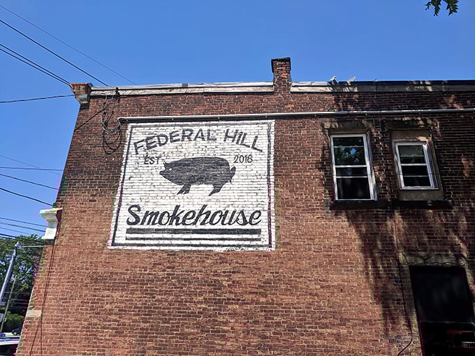 The corner brick building with its iconic pig silhouette sign promises smoked meat paradise within. Erie's barbecue beacon stands ready to welcome hungry pilgrims.