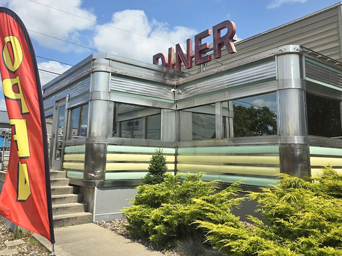 The gleaming stainless steel exterior of Broadway Diner stands like a time capsule in Baraboo, beckoning hungry travelers with its classic Americana charm.