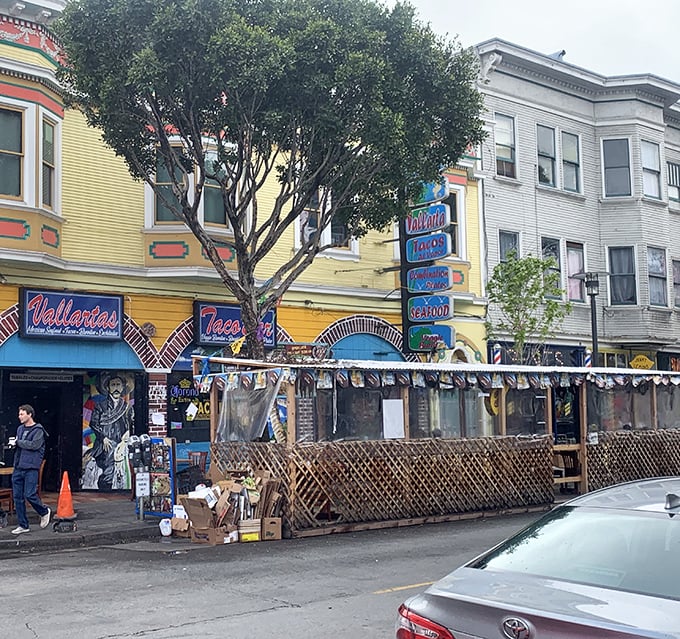 The vibrant yellow exterior of Taqueria Vallarta stands out in San Francisco's Mission District like a beacon of culinary promise.