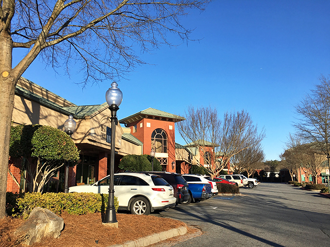 The welcoming facade of West Cobb Diner stands ready to embrace hungry visitors with its brick exterior and classic diner signage.