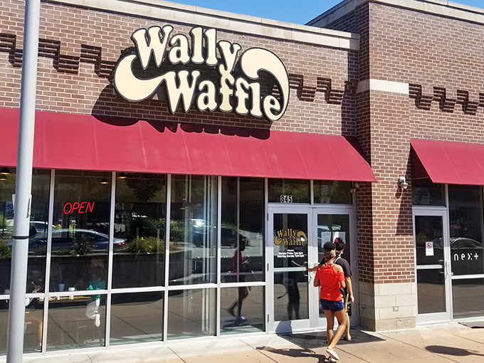 The iconic Wally Waffle storefront beckons hungry Ohioans with its cheerful red awnings and promise of breakfast nirvana.