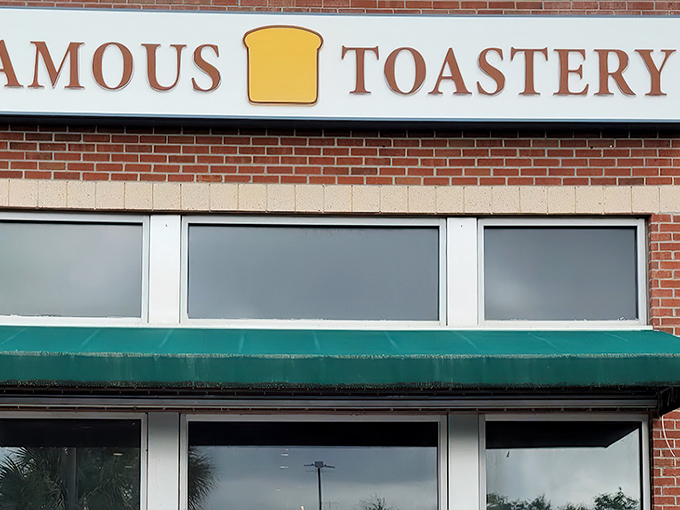 The brick facade with its cheerful green awnings promises breakfast nirvana. Like finding the entrance to Narnia, but with pancakes instead of snow.