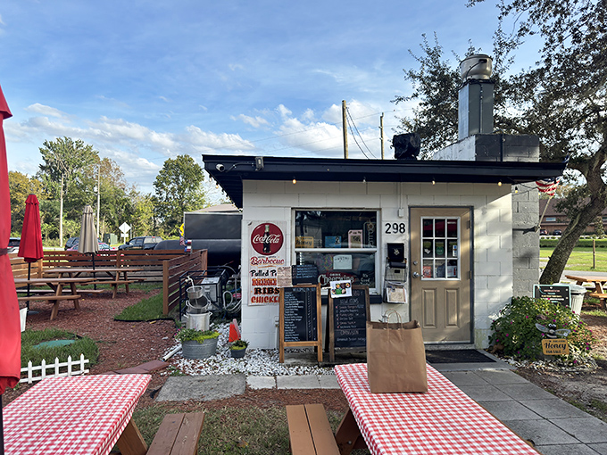 The unassuming exterior of Briskets BBQ Shack & Grill proves that culinary greatness often comes in small packages. That smokestack isn't just for show!