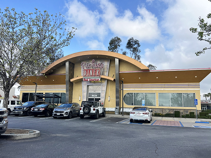 The retro-futuristic facade of Richie's Diner stands proudly against the California sky, like a time portal to when breakfast was an event, not just a meal.