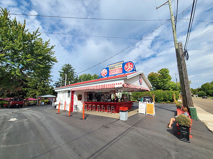 That red-striped awning and classic sign are like a beacon for hungry travelers. This little red-roofed time machine has been serving up nostalgia since Eisenhower was president.