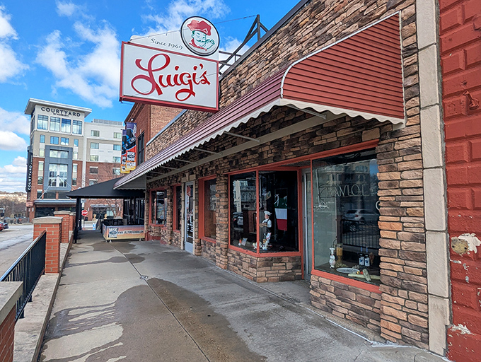 Luigi's iconic brick exterior and vintage sign have welcomed hungry Akronites for generations, standing like a delicious time capsule amid downtown's modern development.