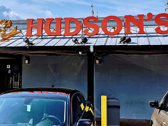 The iconic red Hudson's sign welcomes hungry visitors like a maritime beacon. No fancy frills needed when the seafood speaks for itself.