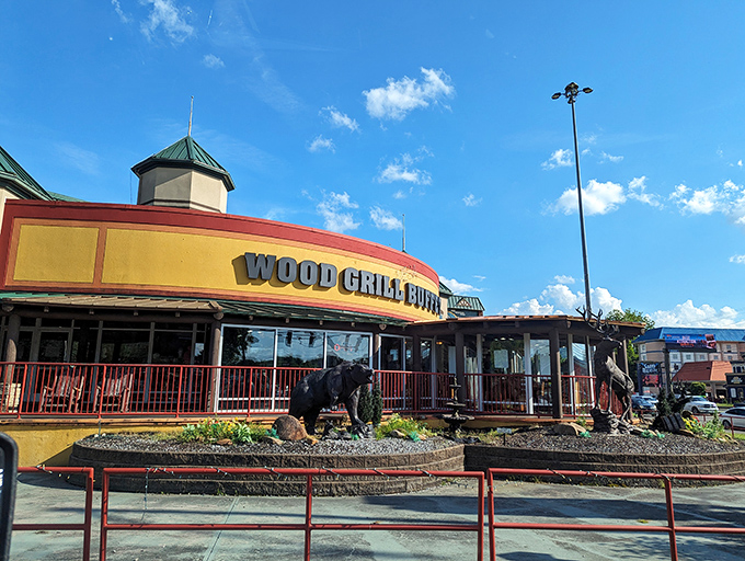 The majestic deer statue welcomes hungry travelers like a woodland ambassador saying, "Trust me, the food inside is worth the stop."