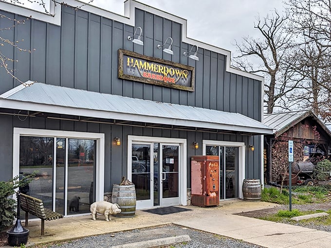 The gray clapboard exterior of Hammerdown Barbecue stands like a temple to smoke and fire, complete with a vintage soda machine that's seen better decades.